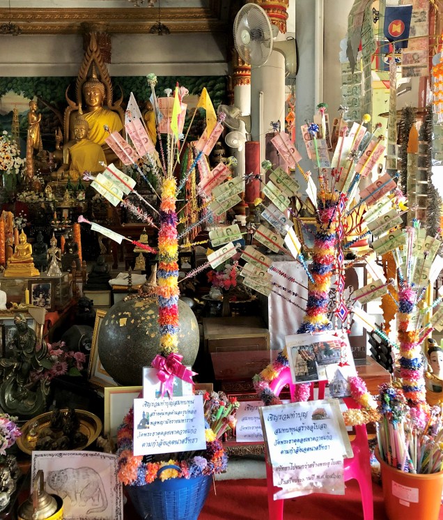 Bee hives, money trees and floating Buddhas at Wat Prah That Doi Khao ...